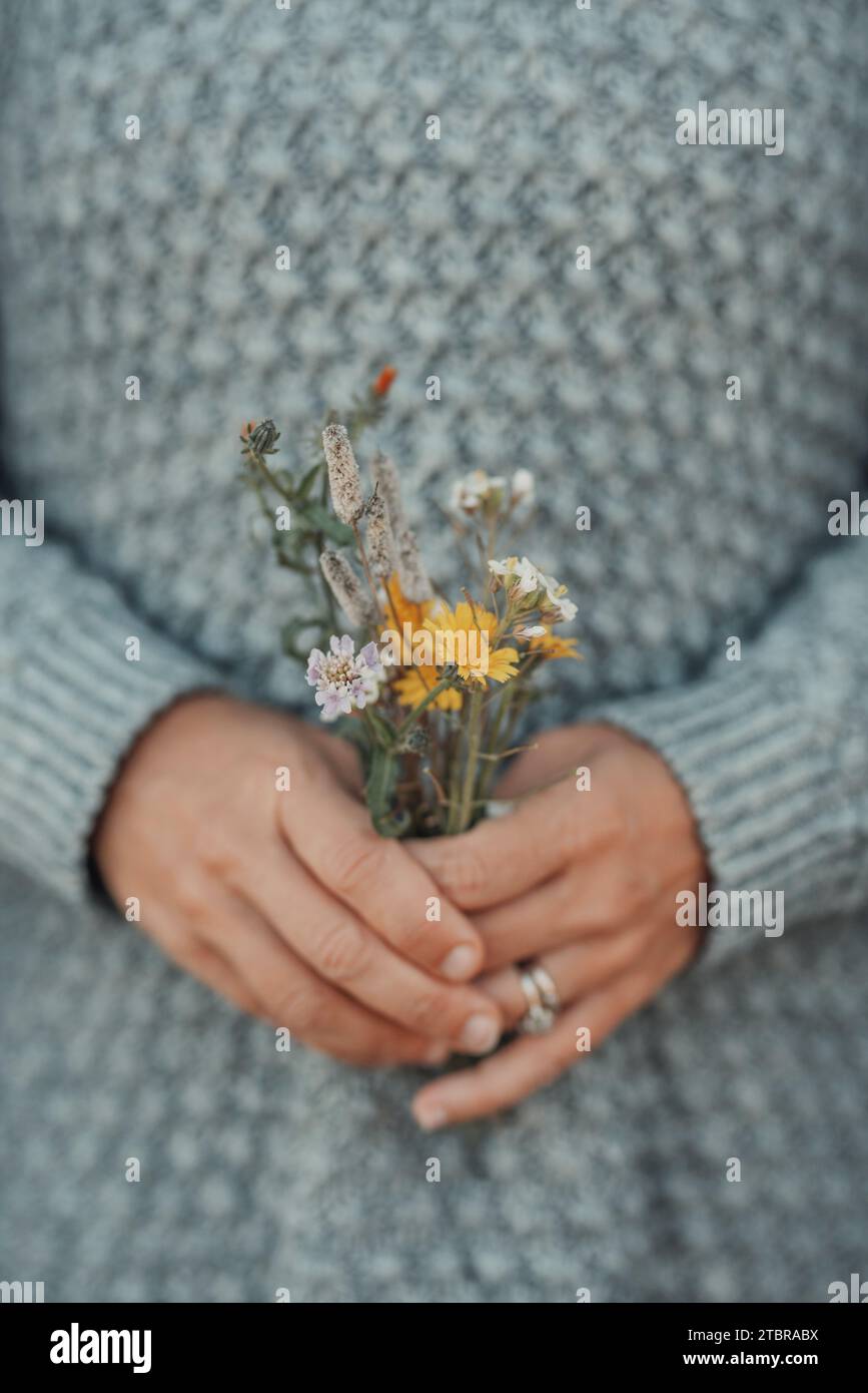 Close up of woman hands holding floreal flowers natural bouquet from ...