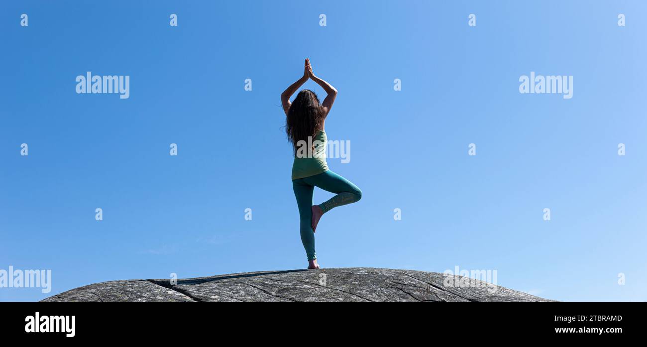 Blue sky yoga hi-res stock photography and images - Alamy