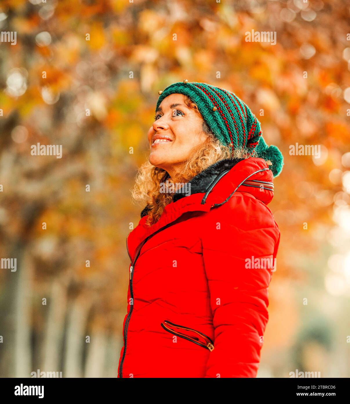 Young happy cheerful adult woman posing outdoor and enjoying leisure ...