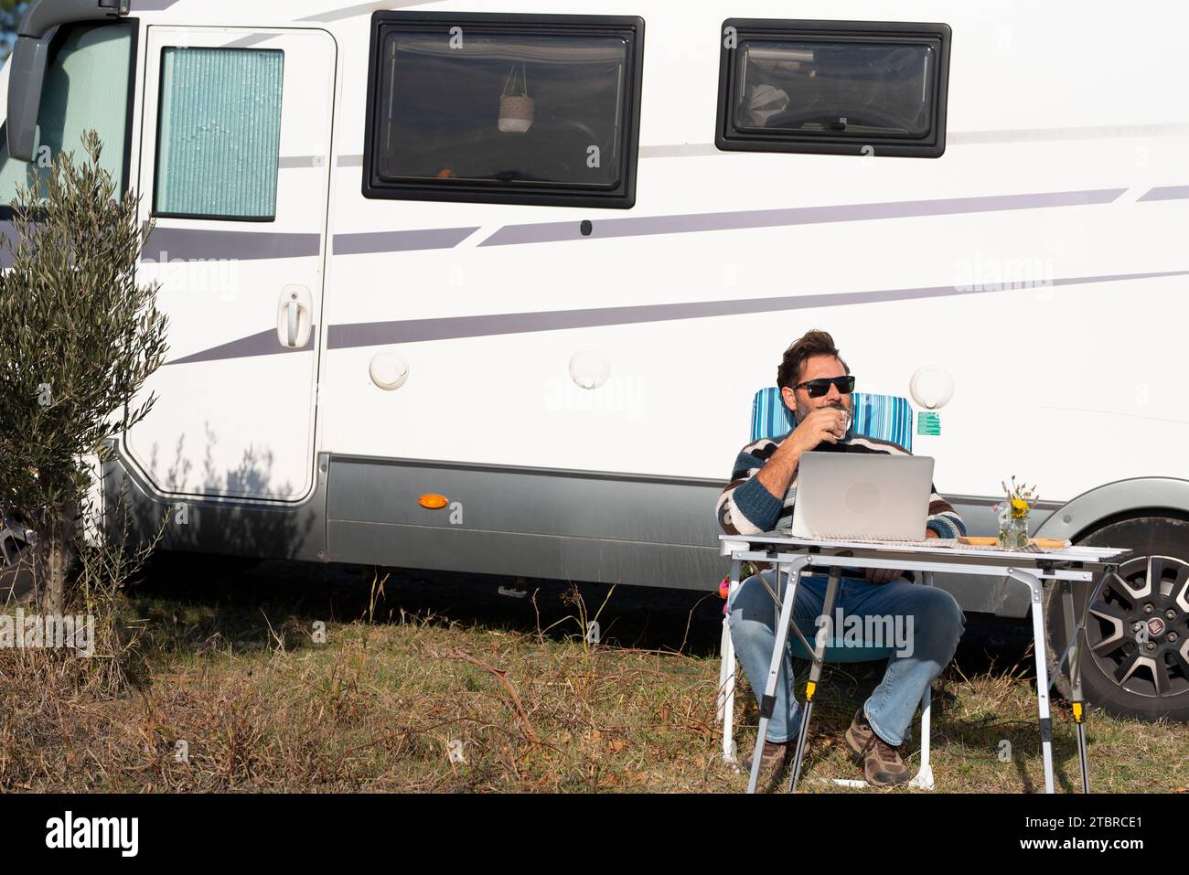 One man digital nomad lifestyle working on alternative outside ...