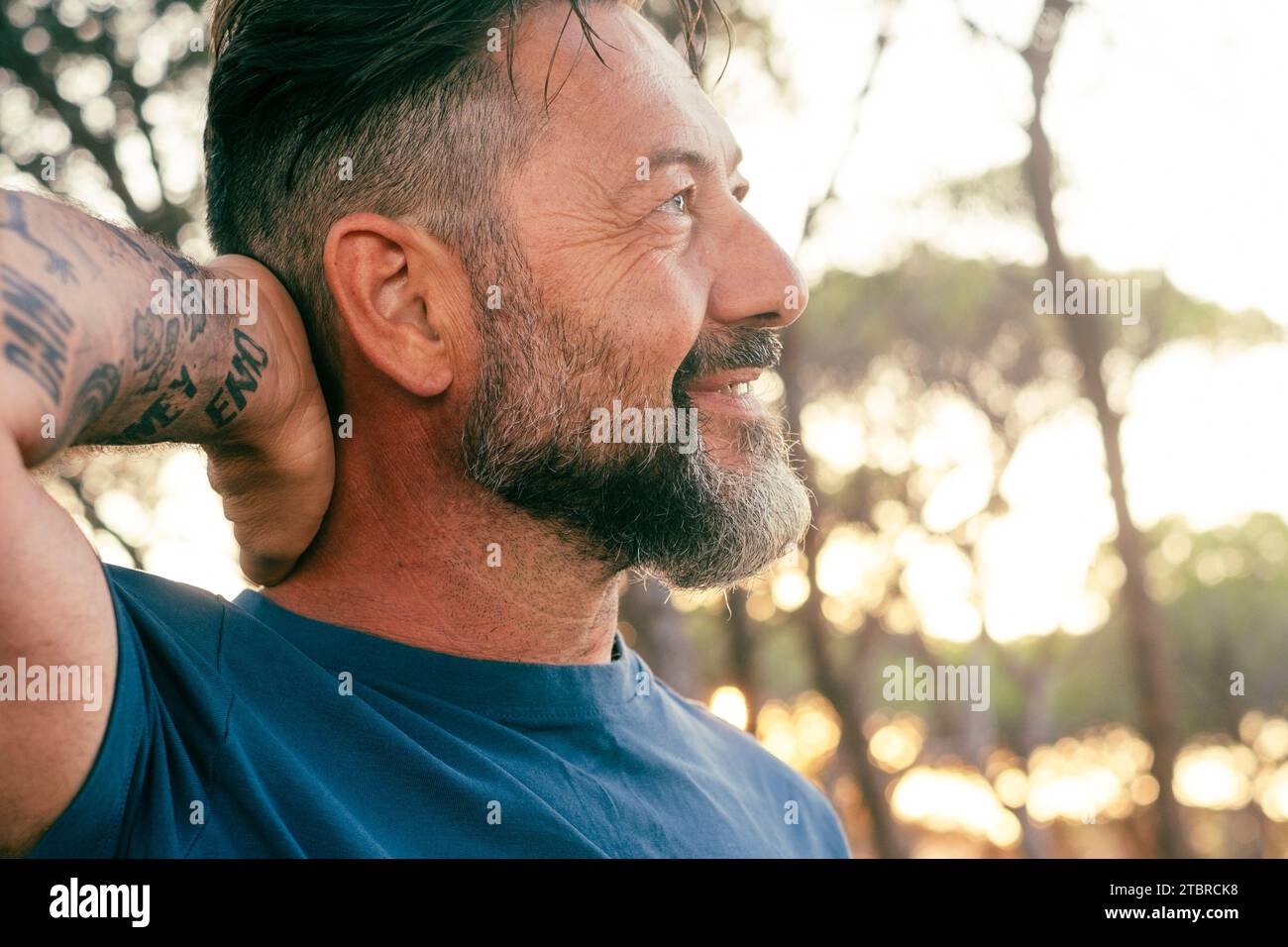 Close up side view portrait of happy adult man smiling and enjoying ...