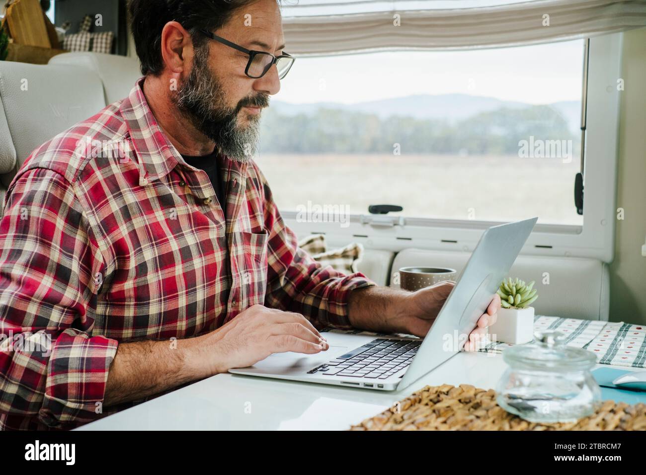 Digital nomad fulltimer traveler people using computer inside a ...