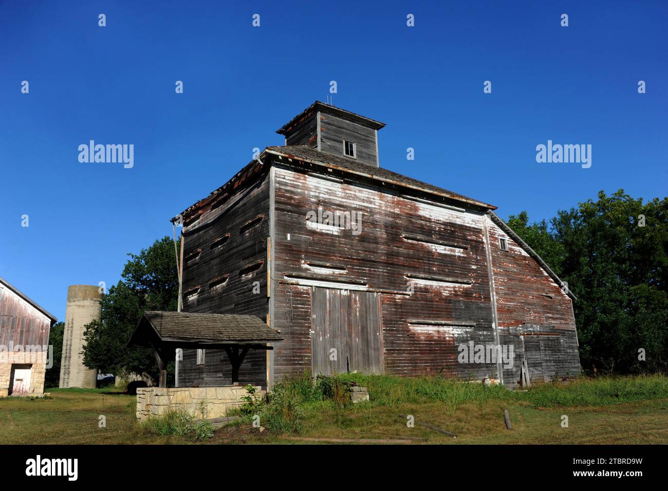 Unique barn structure has cupola on top. Barn at one time was painted ...