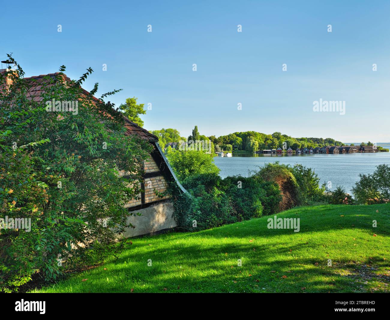 Old half timbered house on the lakeshore in robel hi-res stock ...
