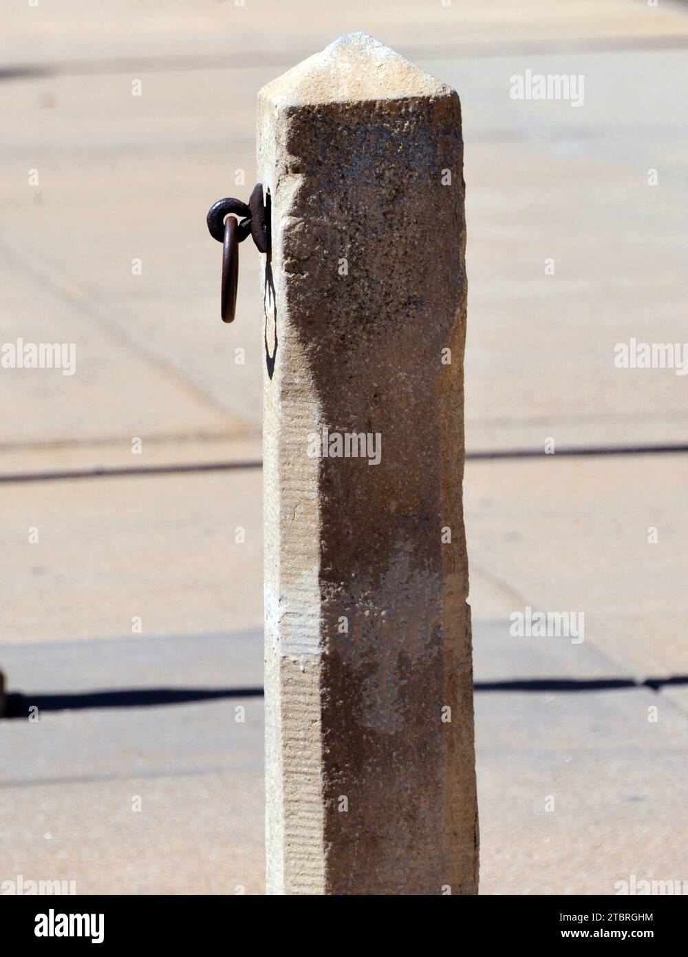 Concrete post has steel ring, used for hitching horses, in Council ...