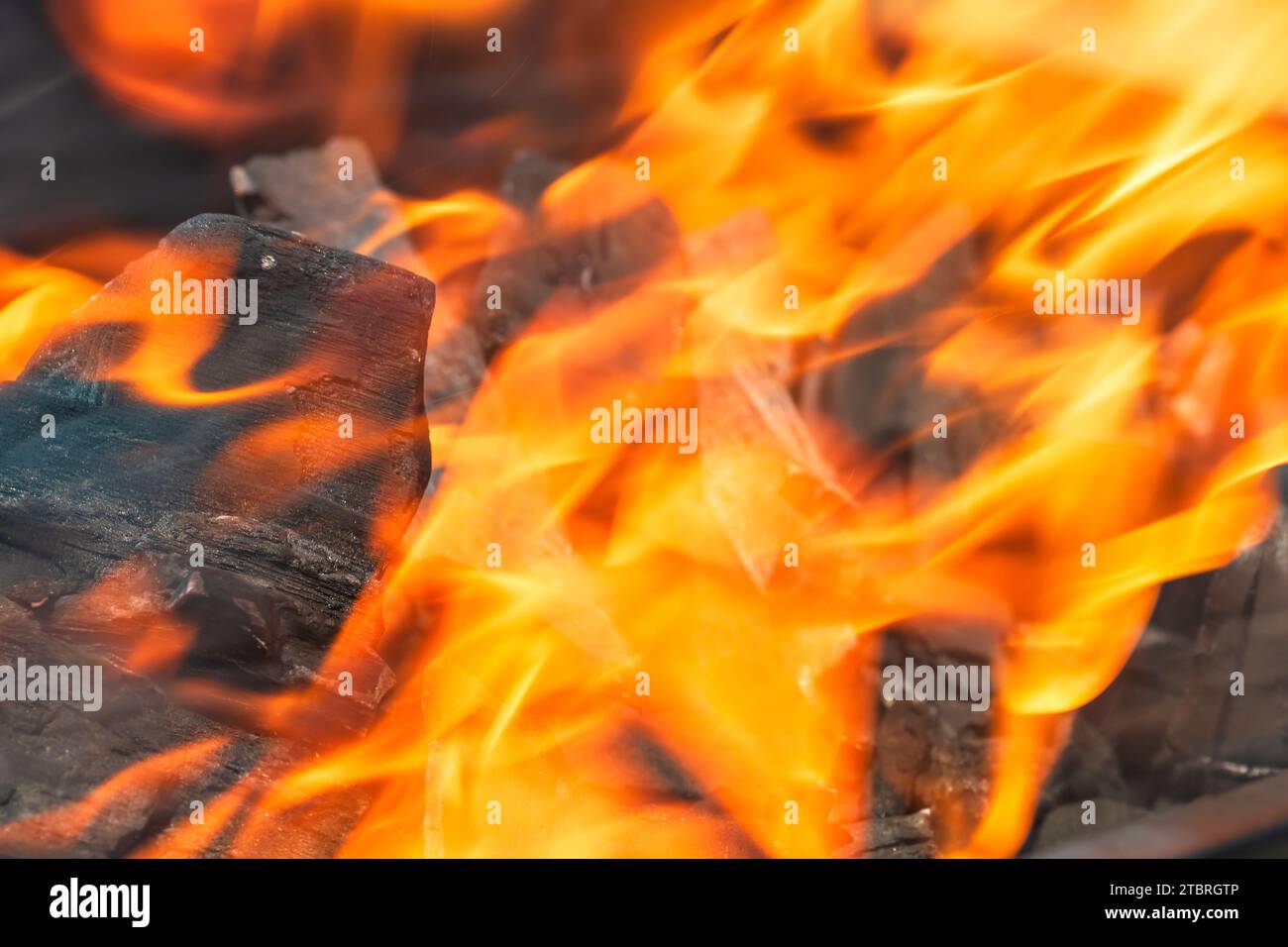 Barbecue grill pit with glowing and flaming hot open fire with red ...