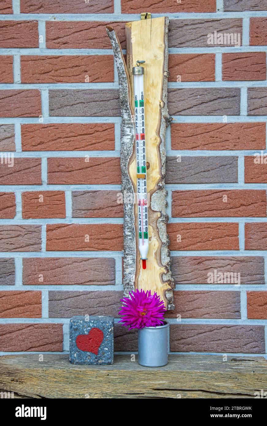 Old mercury thermometer in wooden frame on a house wall, decorative ...