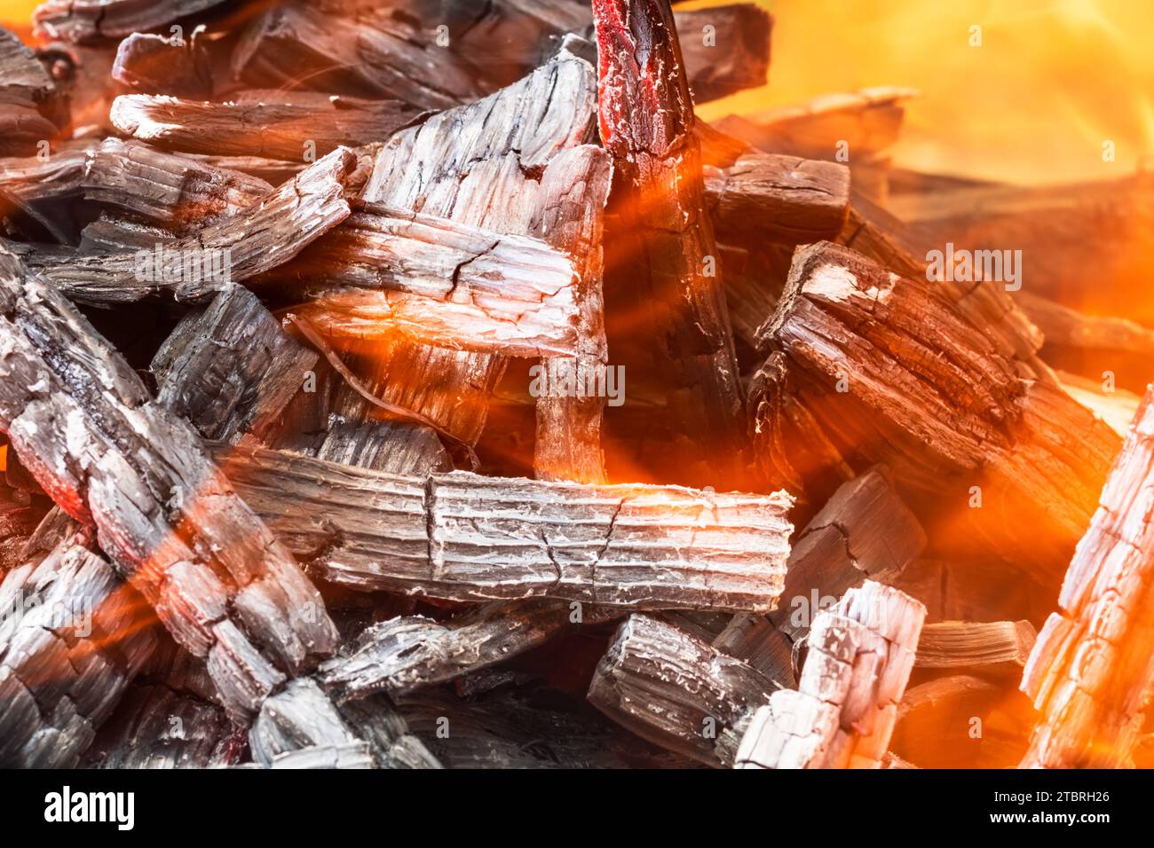 Burning wood chips forming coal. Barbecue preparation, fire before ...