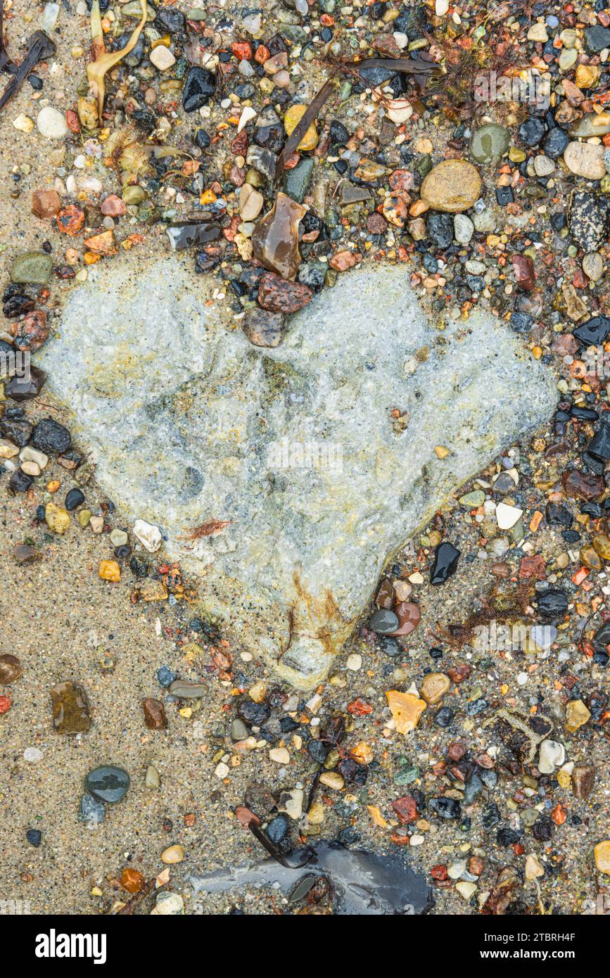 Heart shape on the beach with stones Stock Photo - Alamy