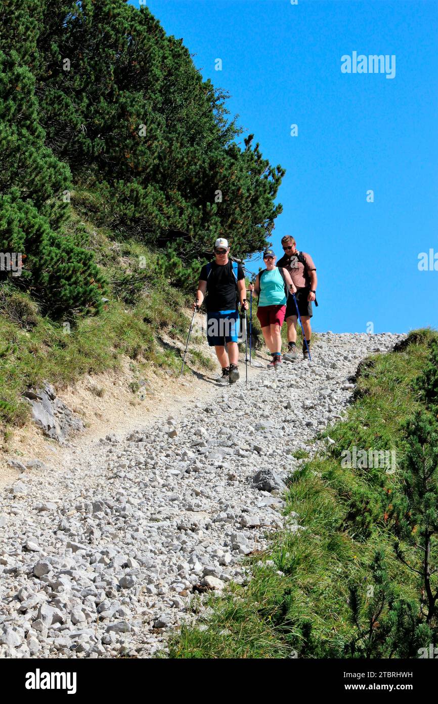 Woman and two men on a hike from the Lafatscher Joch into the Halltal ...