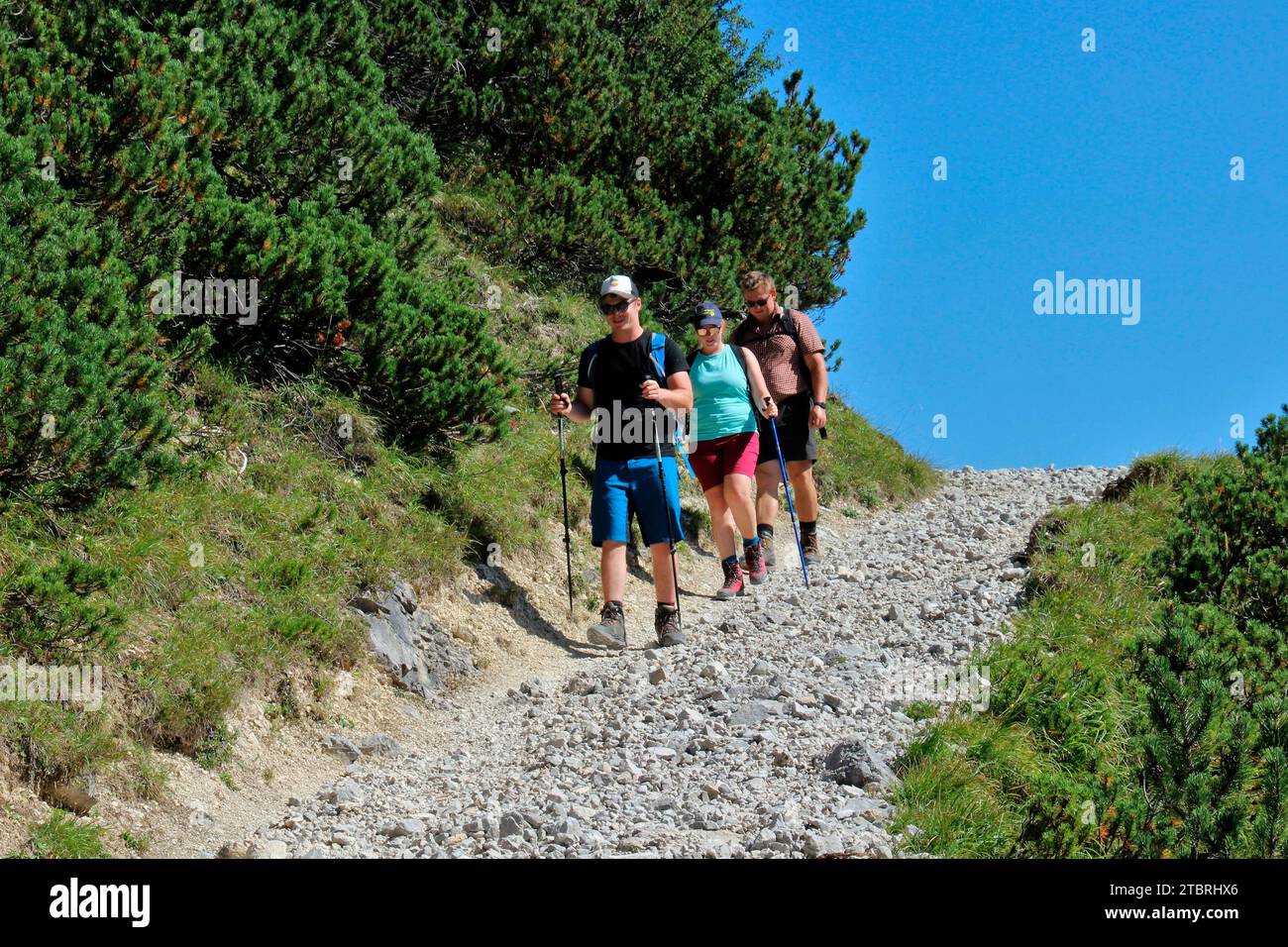 Woman and two men on a hike from the Lafatscher Joch into the Halltal ...