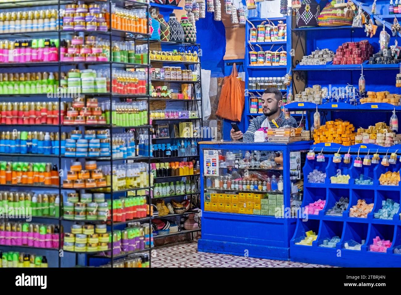 Moroccan vendor of soap in beauty shop selling cosmetics in medina ...