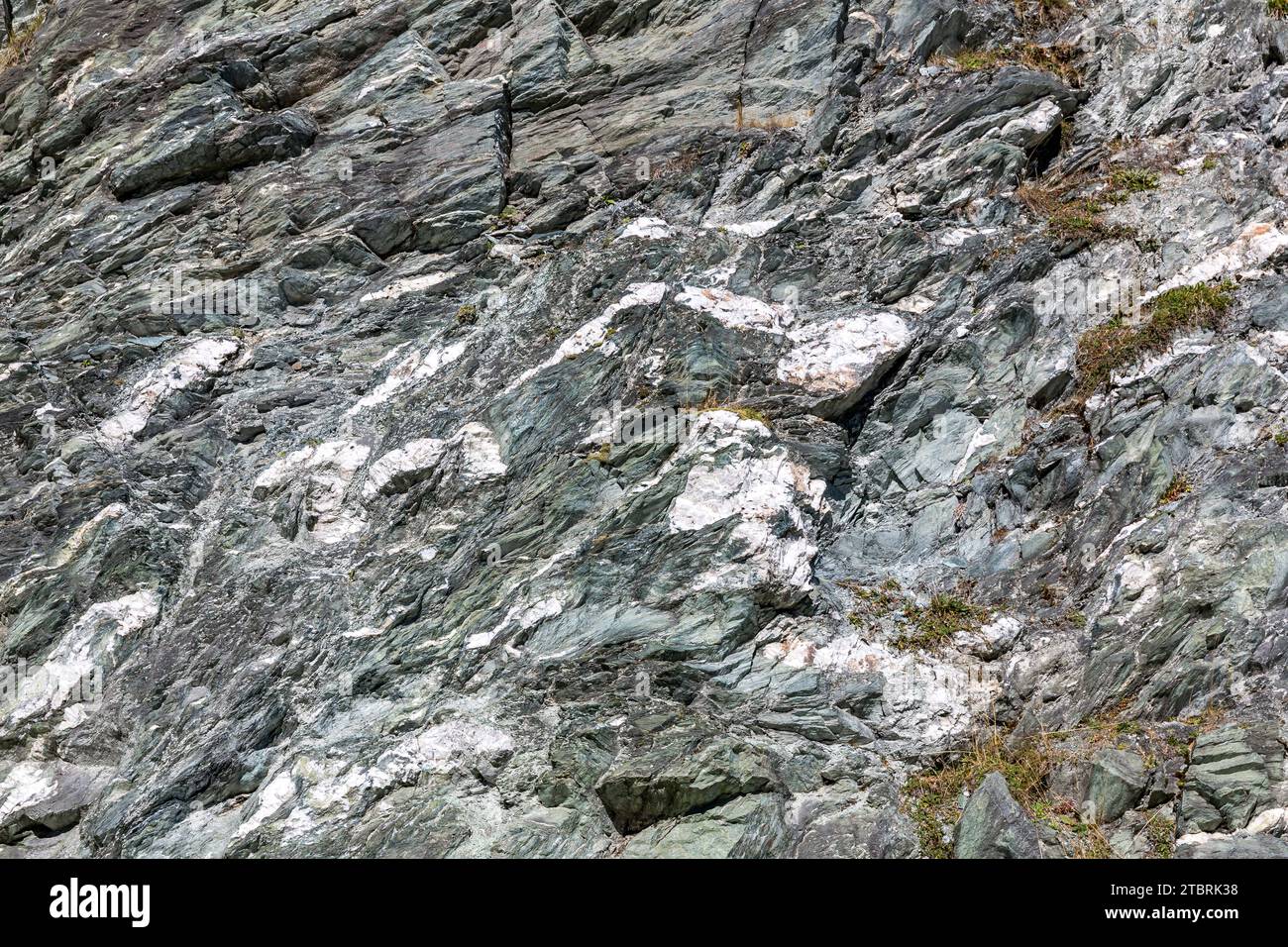 Greenish mica schist rock with marble layers, alpine path to the ...