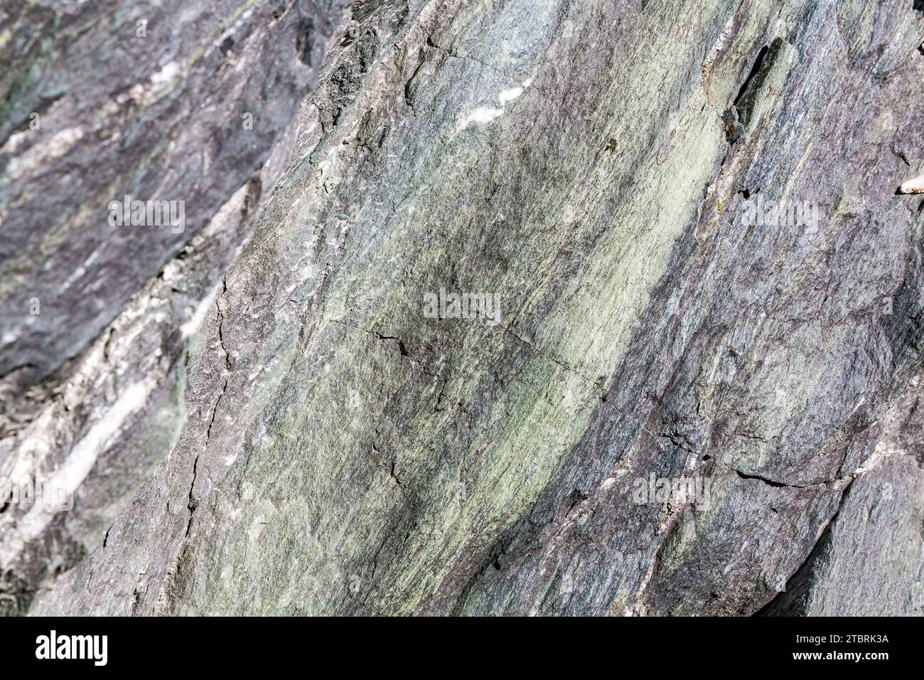 Greenish mica schist rock with marble layers, alpine path to the ...