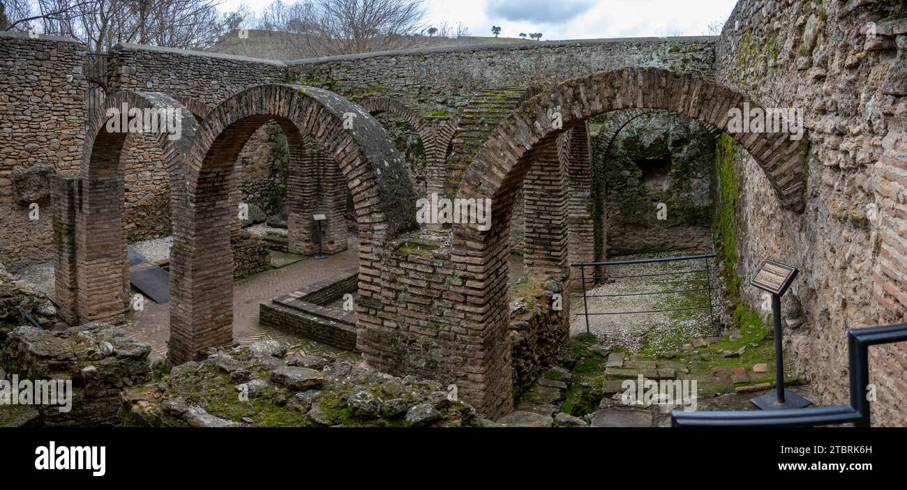 Ancient brick arches and columns in a historic building with unique ...