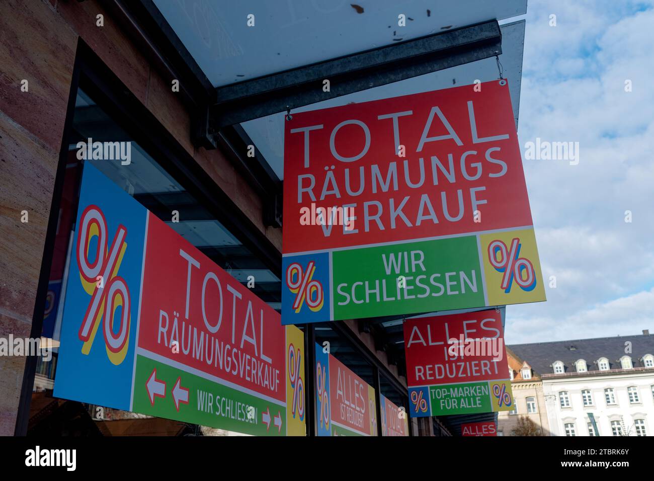 Crisis in retail, signs indicate clearance sale due to store closure ...