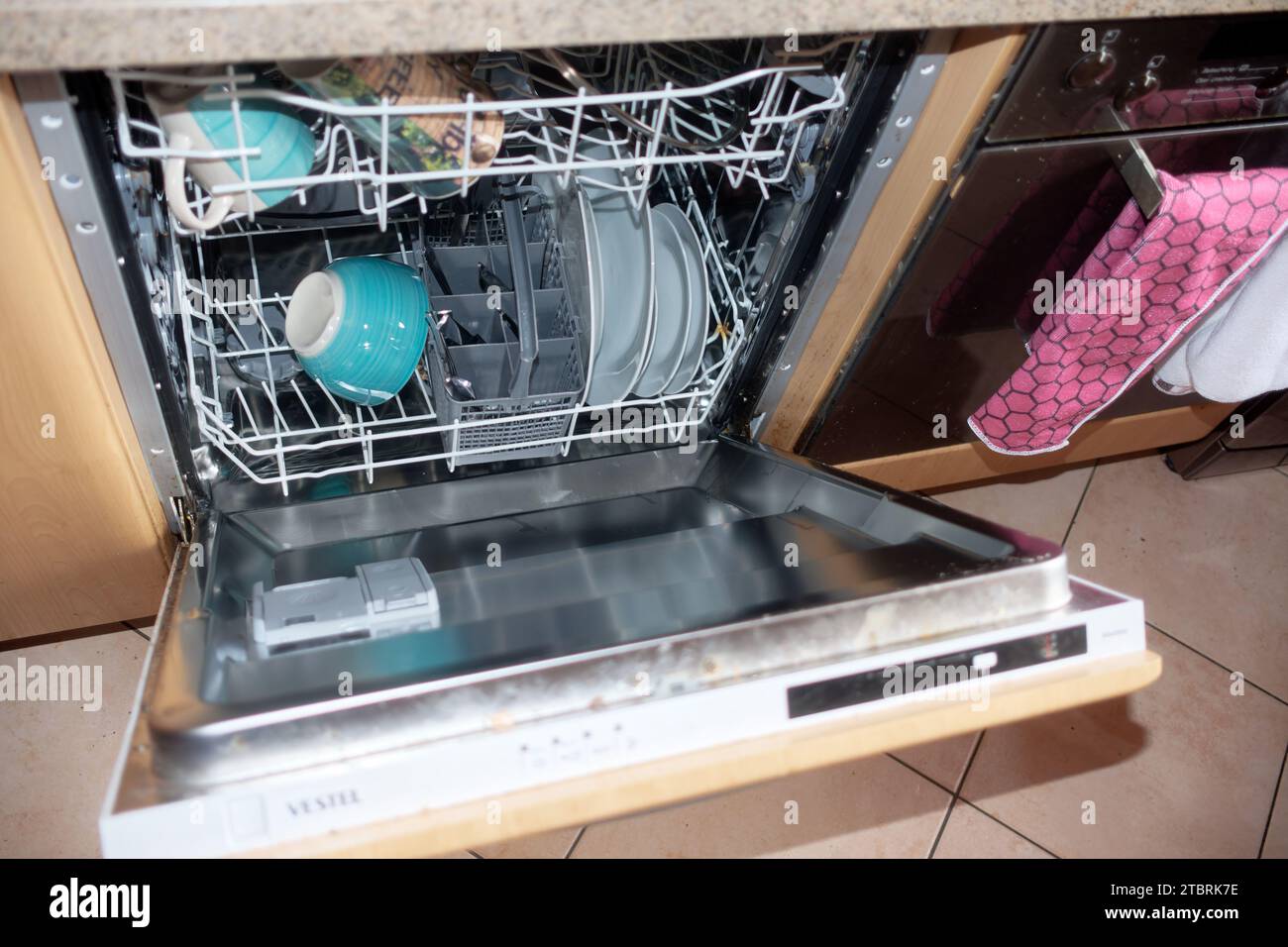 Open dishwasher filled with dishes Stock Photo - Alamy
