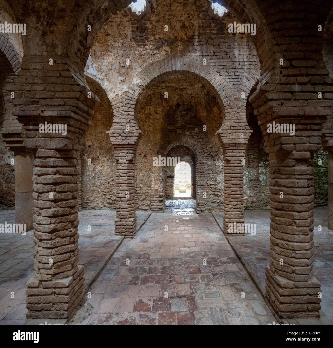 Ancient brick arches and columns in a historic building with unique ...