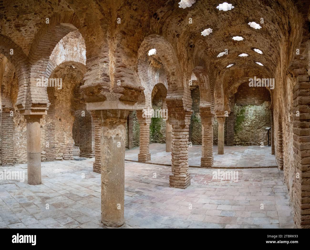 Ancient brick arches and columns in a historic building with unique ...