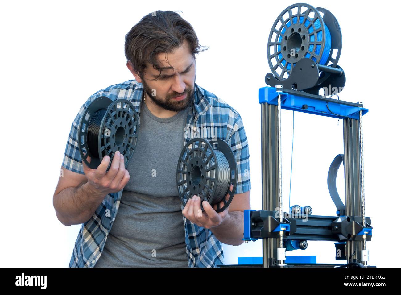 Man selecting filaments to make a 3D print Stock Photo - Alamy