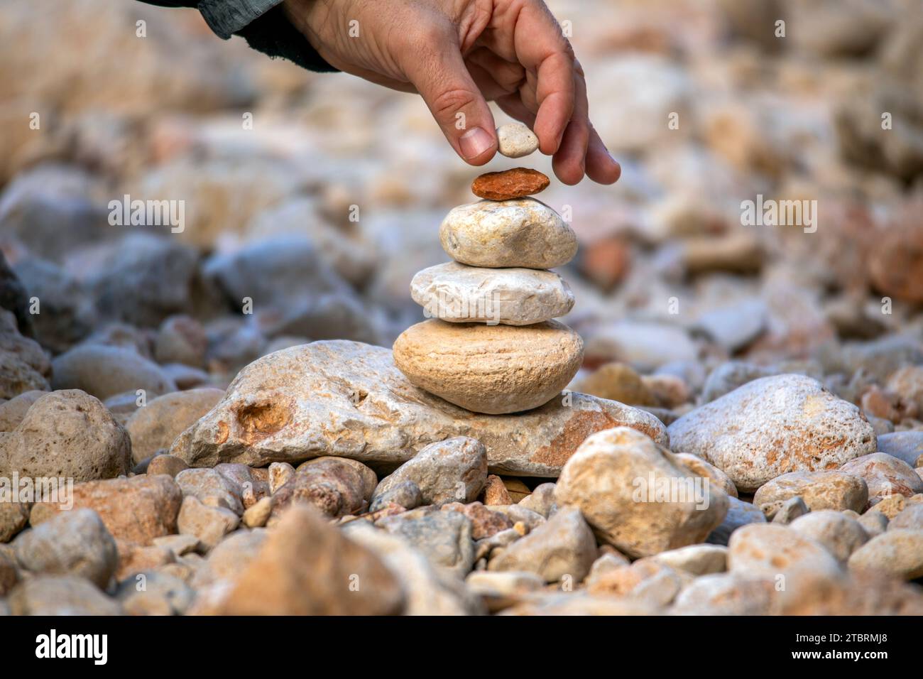 Hand top on pyramid hi-res stock photography and images - Alamy