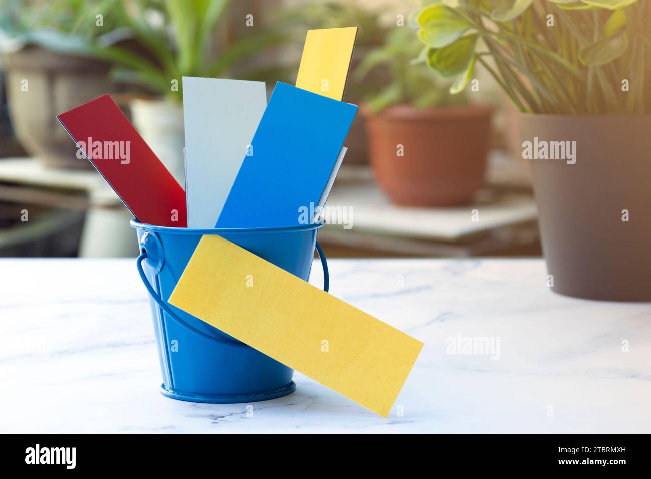 Colorful paper inside of a blue bucket with copy space. Bucket list ...