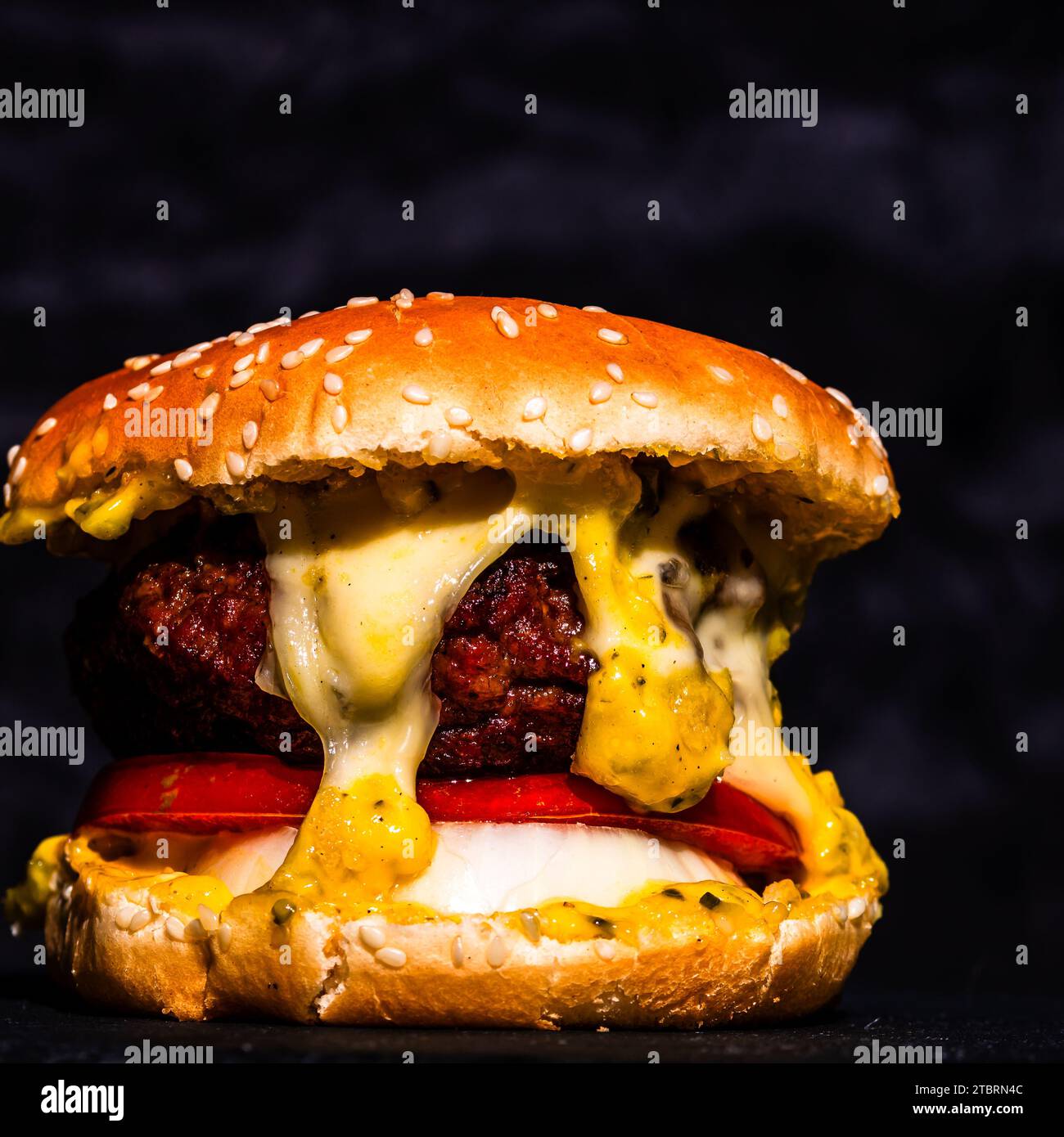 Tasty home made cheeseburger. Cheese burger with pickles, tomatoes ...