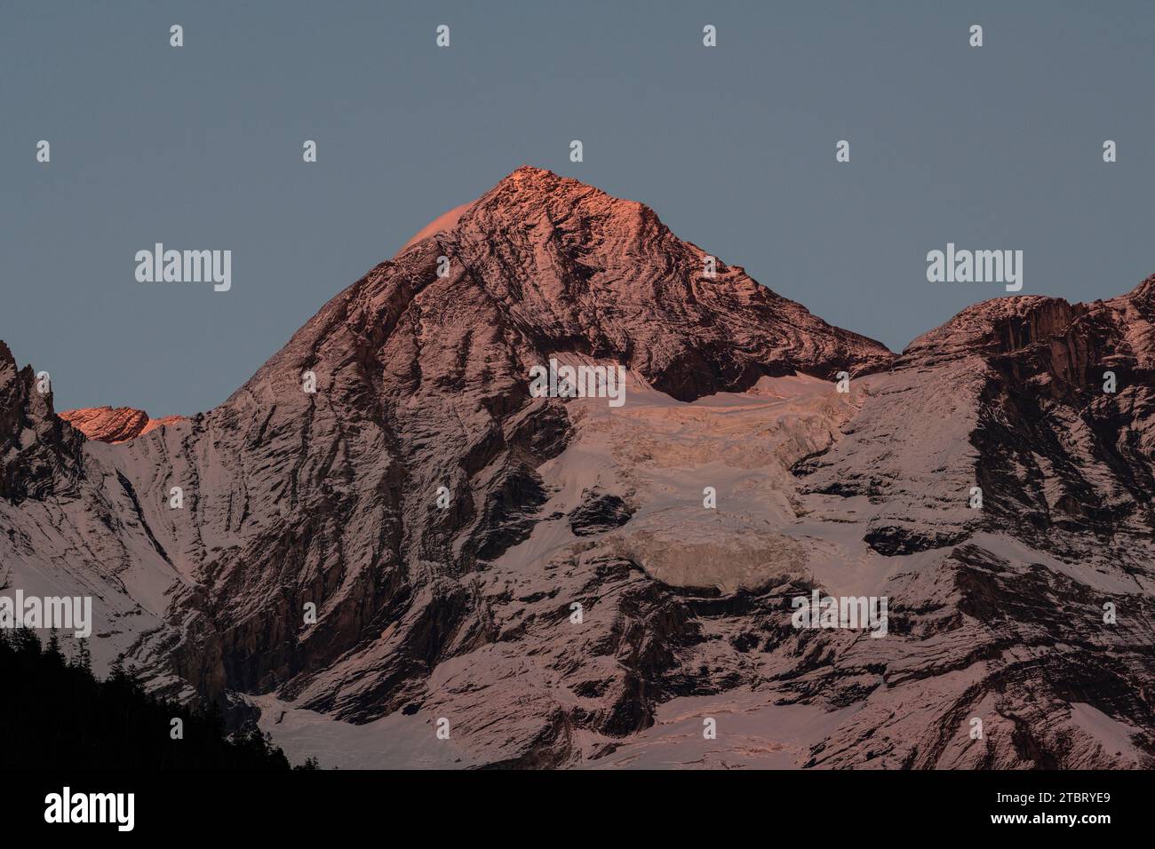 The peaks above Kandersteg at sunset Stock Photo - Alamy