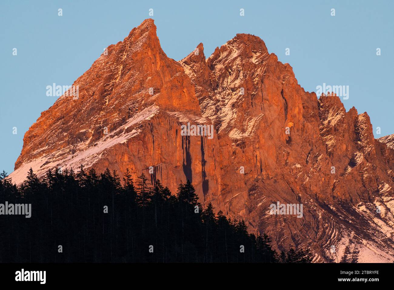 The peaks above Kandersteg at sunset Stock Photo - Alamy