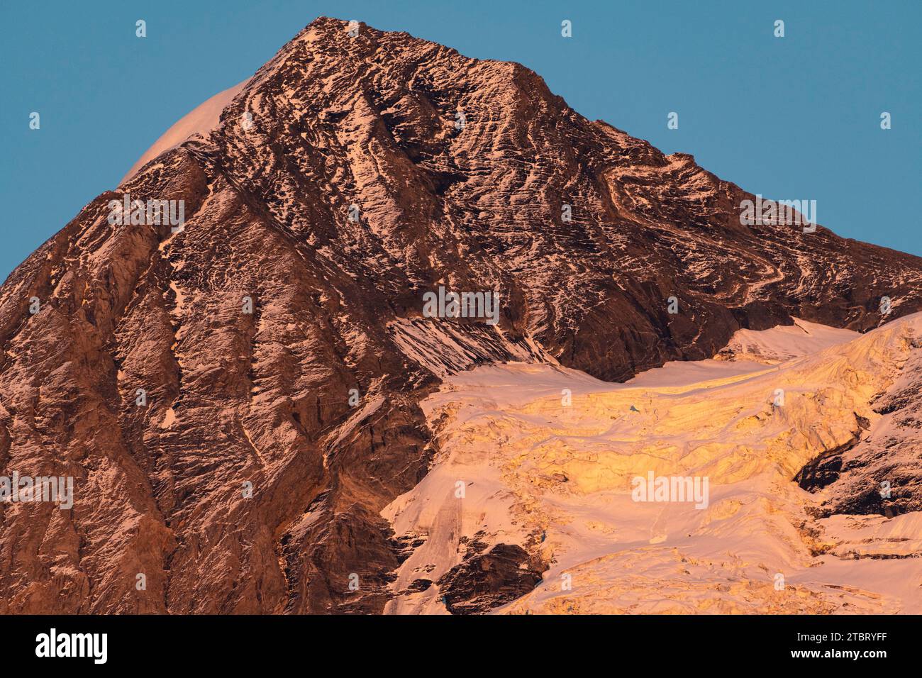 The peaks above Kandersteg at sunset Stock Photo - Alamy