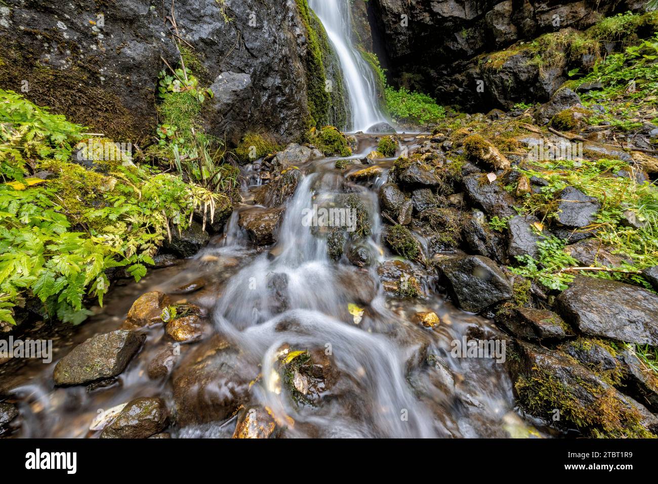 The Cascate sul Ruf de pent waterfall near Canazei in the Italian ...