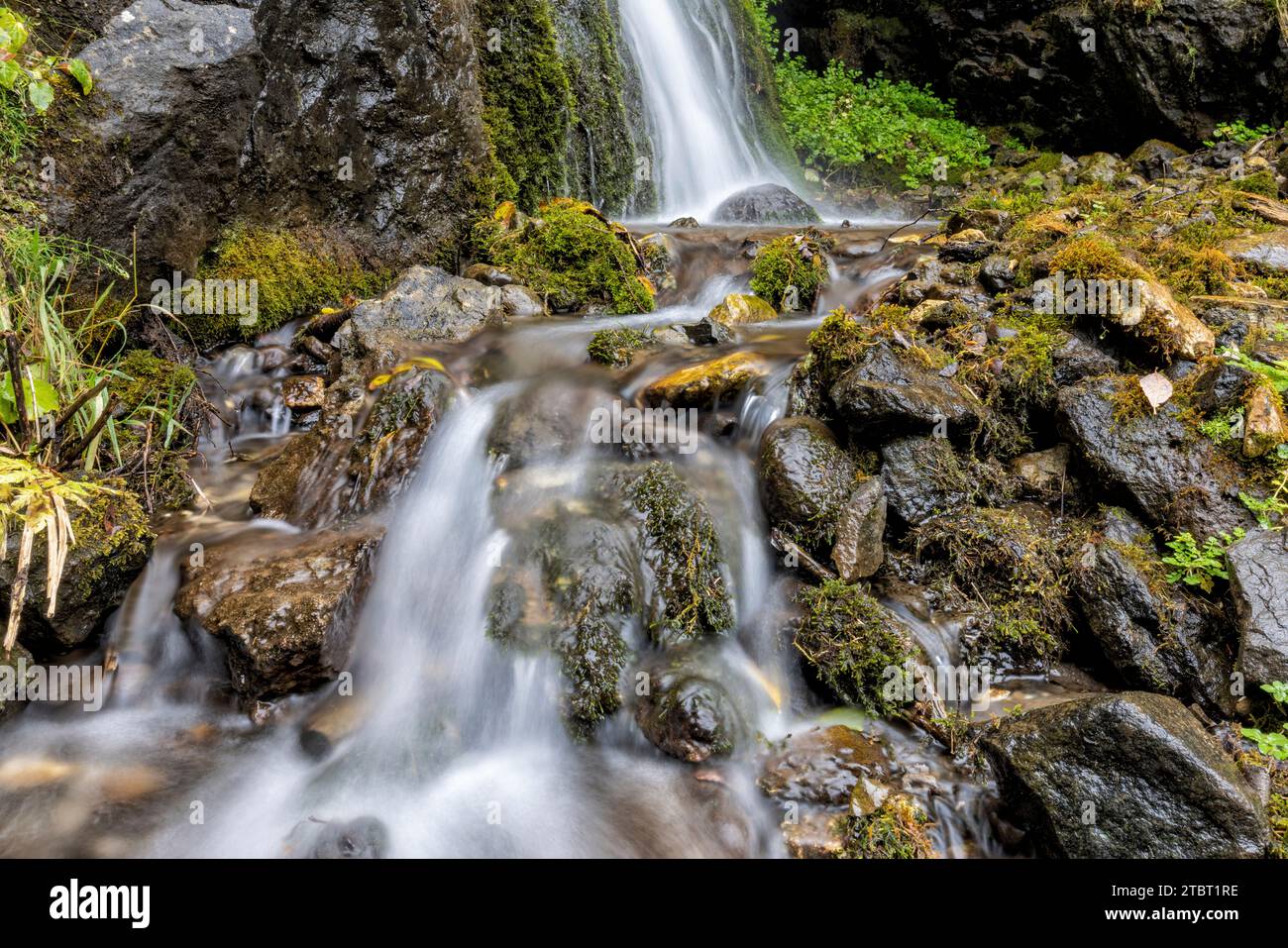 The Cascate sul Ruf de pent waterfall near Canazei in the Italian ...
