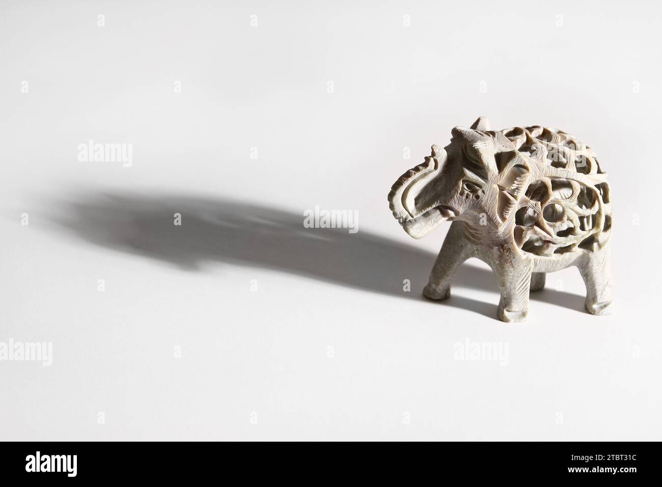 High Angle View of Intricately Carved Ivory Elephant Figurine on White ...