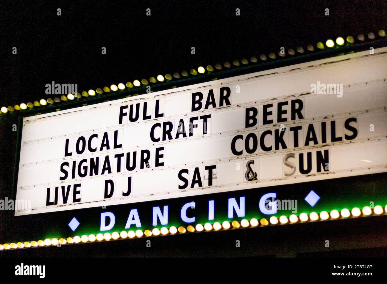 Marquee sign advertising a full bar, local craft beer, signature ...