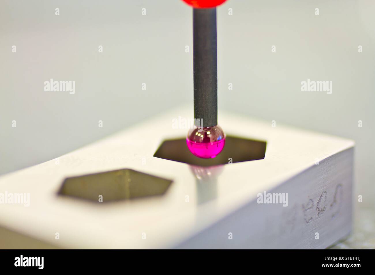 Close Up of Pink Probe CMM Inspection of Industrial Part in Light ...