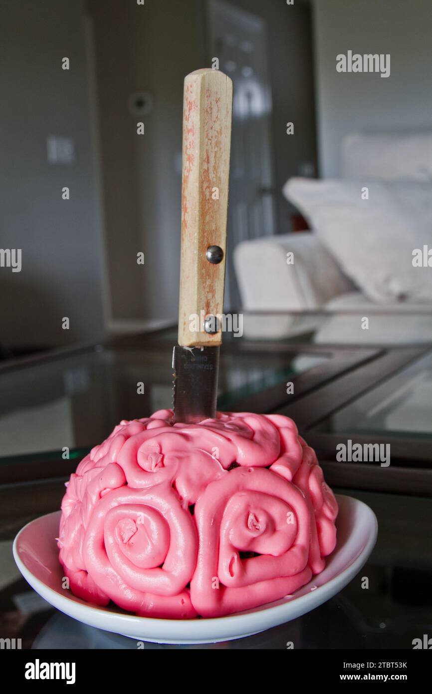 Brain-Themed Pink Cake with Knife in Domestic Setting Stock Photo - Alamy