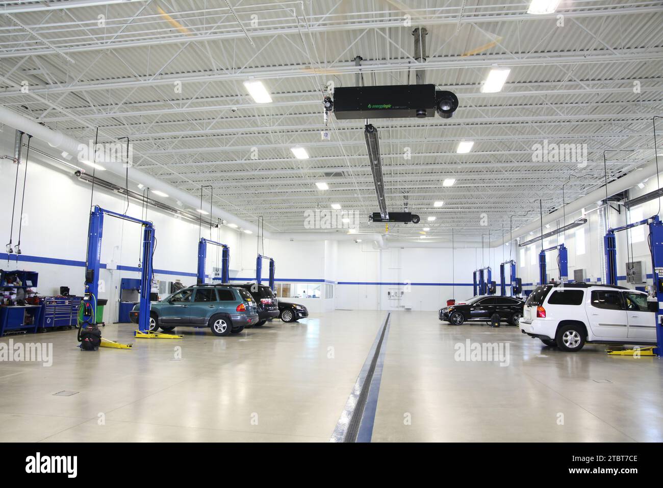 Modern Vehicle Service Center Interior with Blue Car Lifts Stock Photo ...