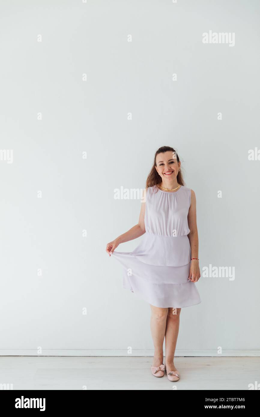 woman 40 years old in light light summer dress Stock Photo - Alamy