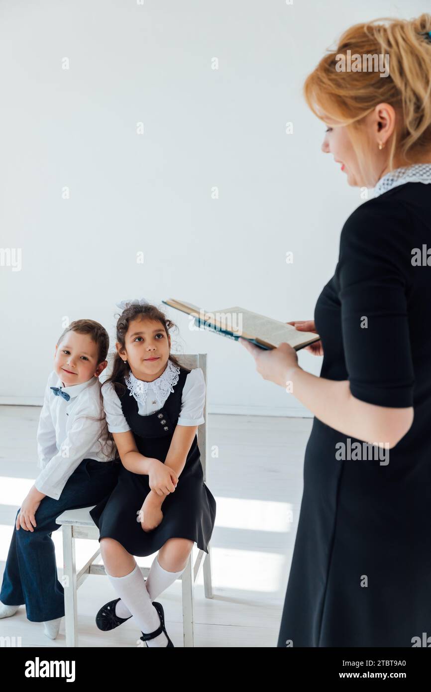 Teacher teaching children in school Stock Photo - Alamy