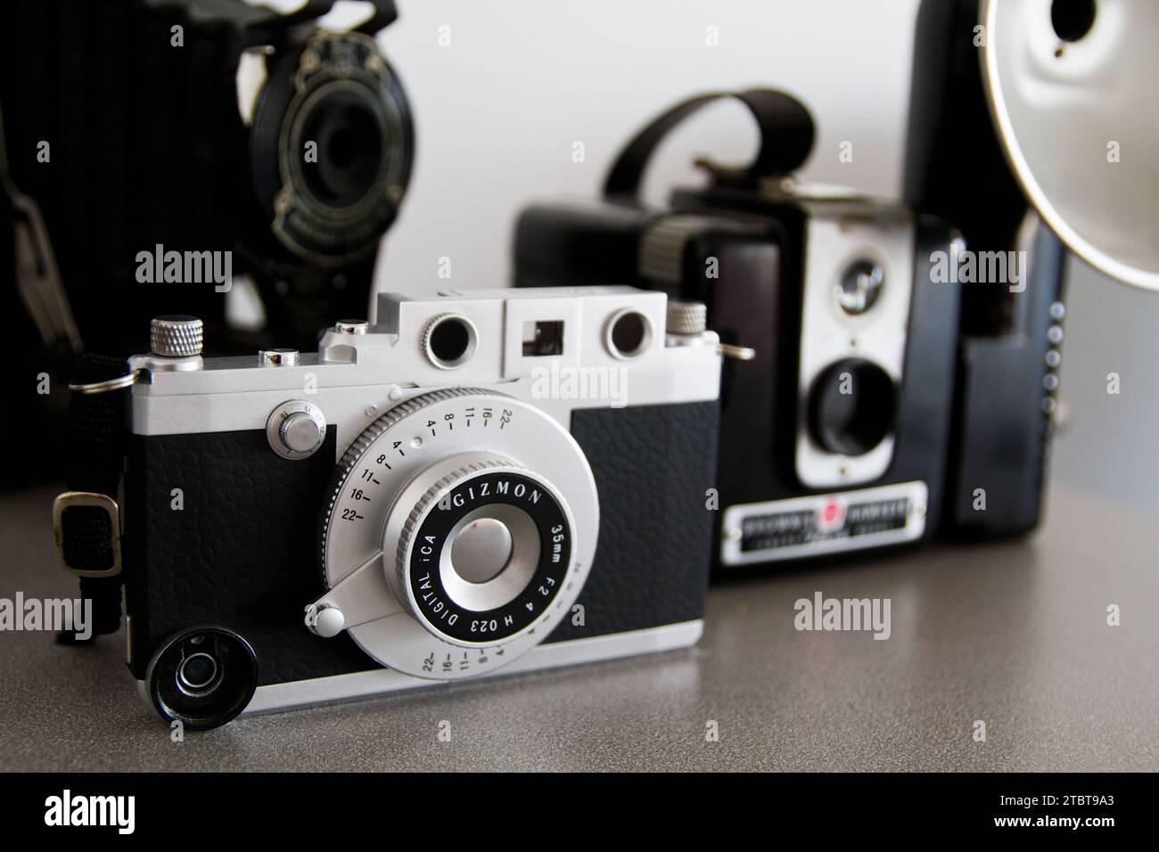 Classic Gizmon Camera and Vintage Photography Equipment on Grey Surface ...