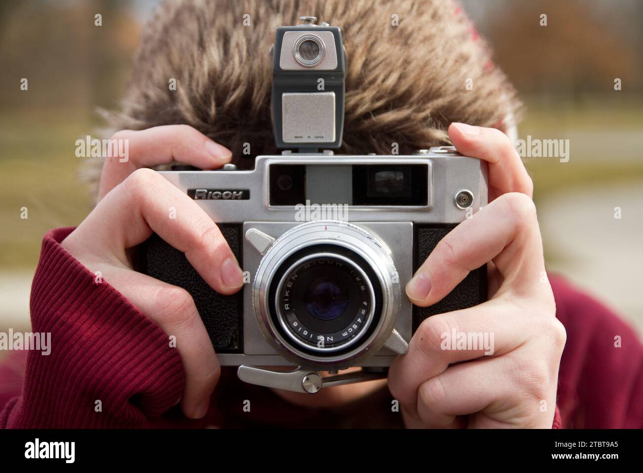 Female Photographer Capturing Winter Scenery with Vintage Film Camera ...