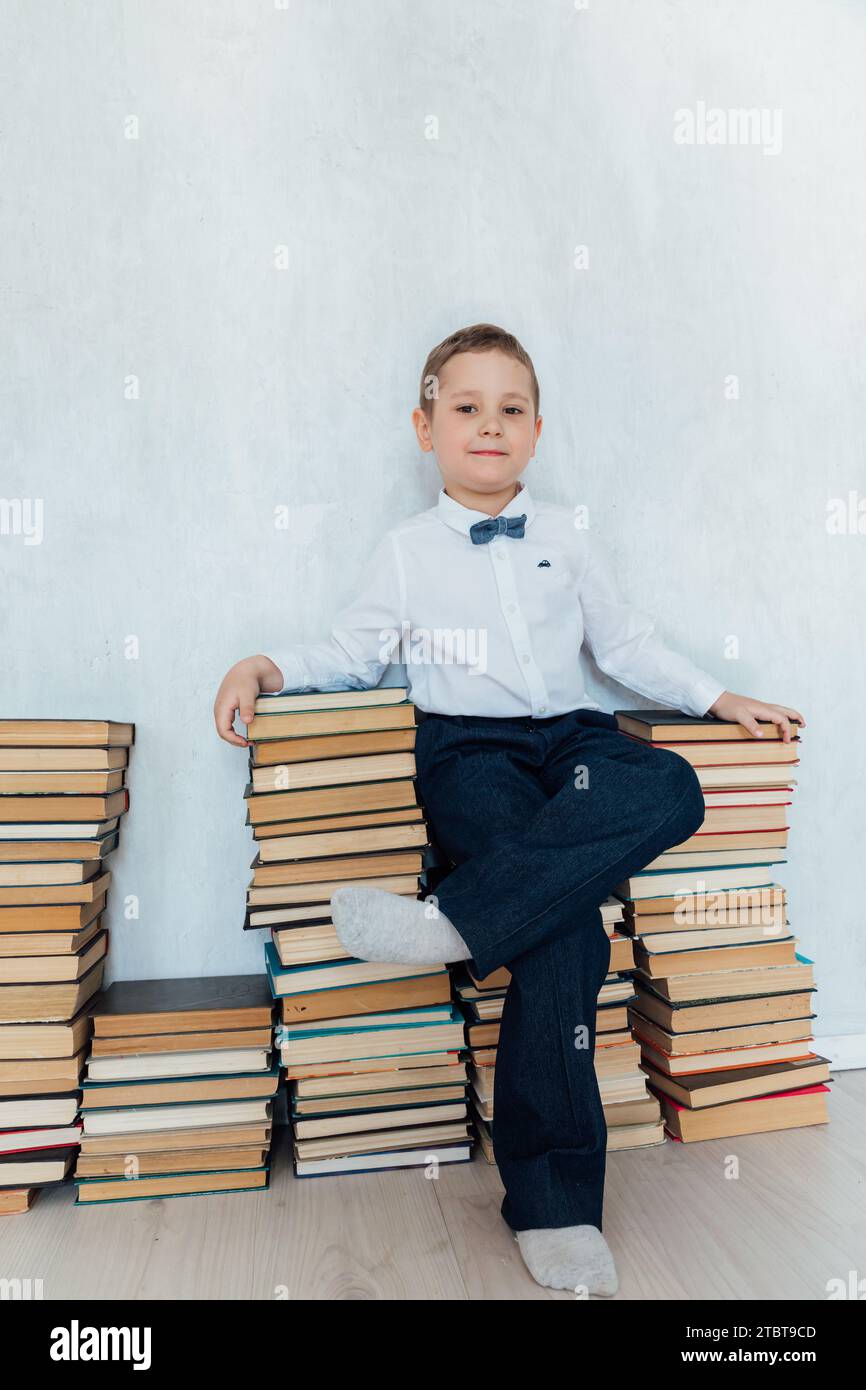 Cartoon boy reading on stack hi-res stock photography and images - Alamy