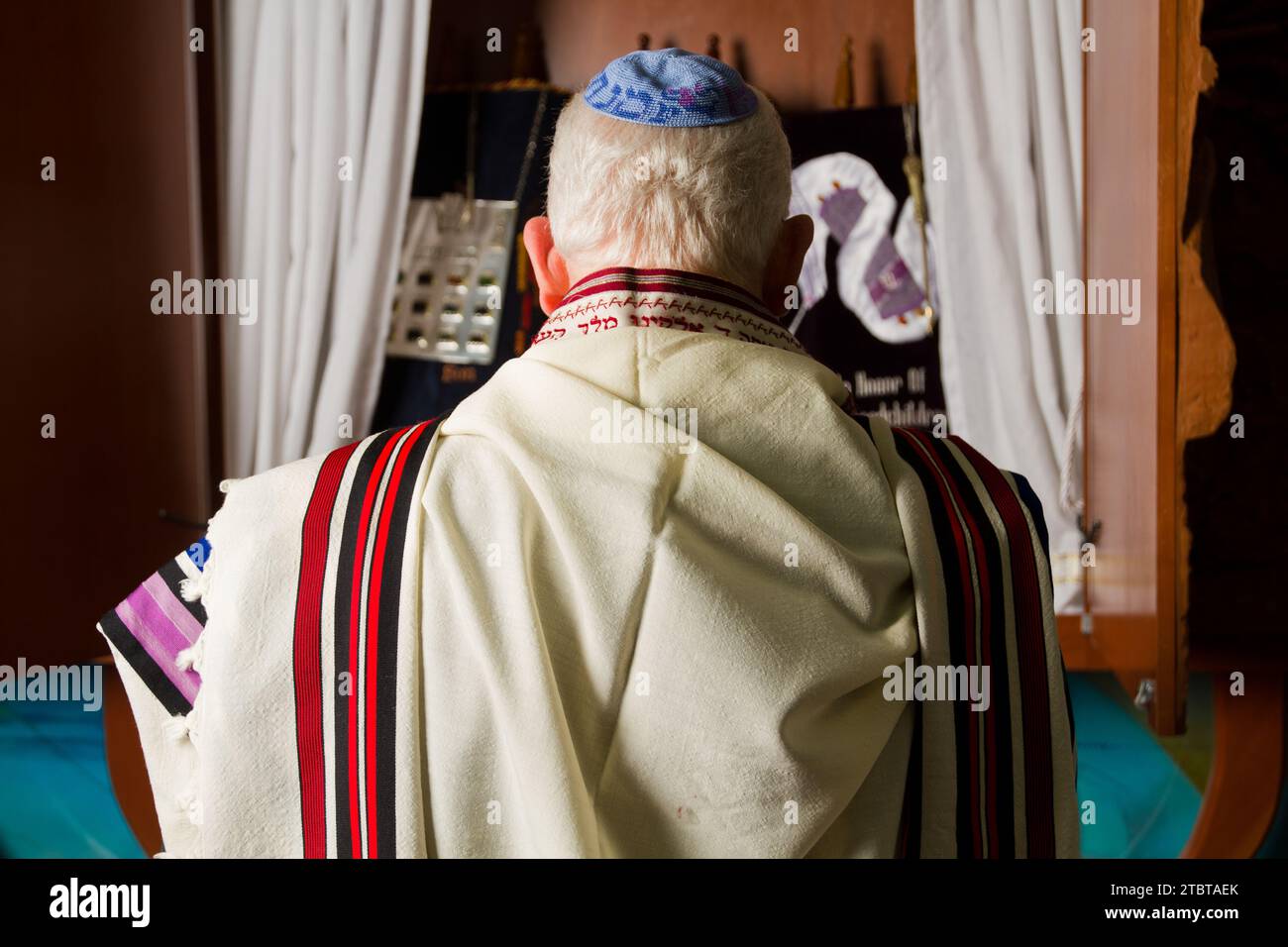 Jewish Worship with Traditional Tallit and Kippah in Synagogue Setting ...