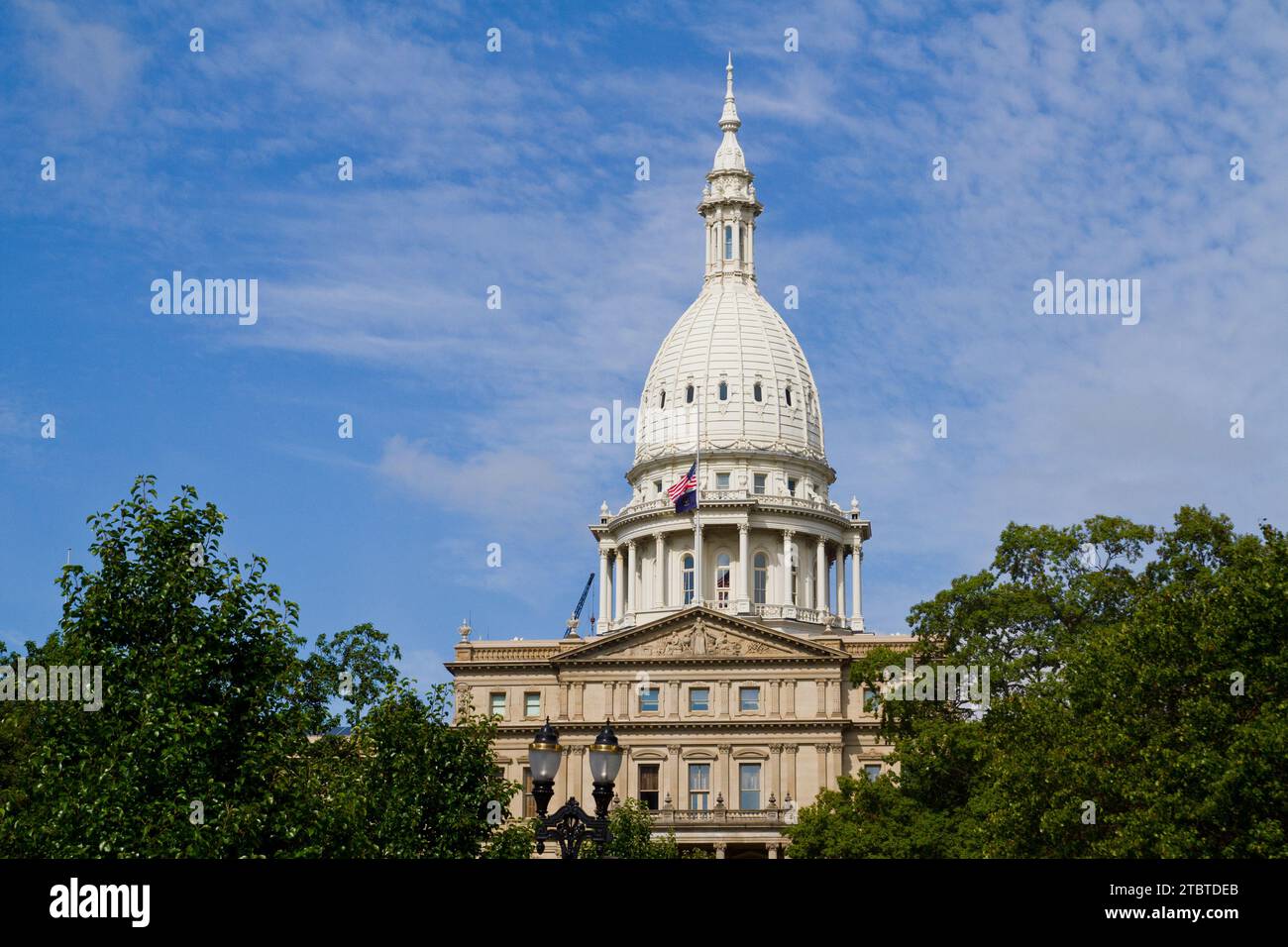 Neoclassical State Capitol Building with American Flag in Lansing ...