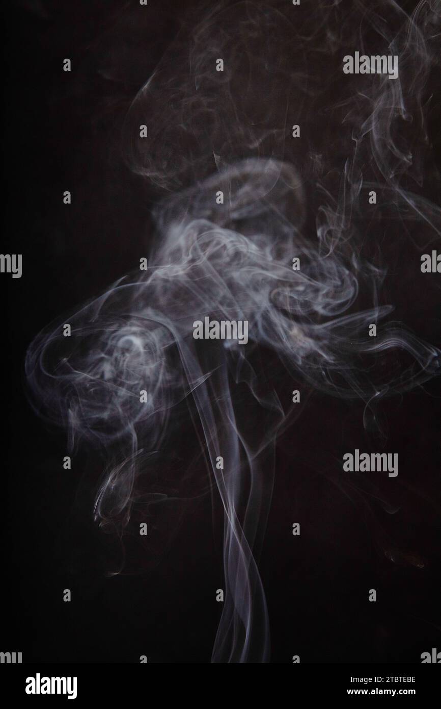 Ethereal Incense Smoke Flowing on Dark Background Stock Photo - Alamy
