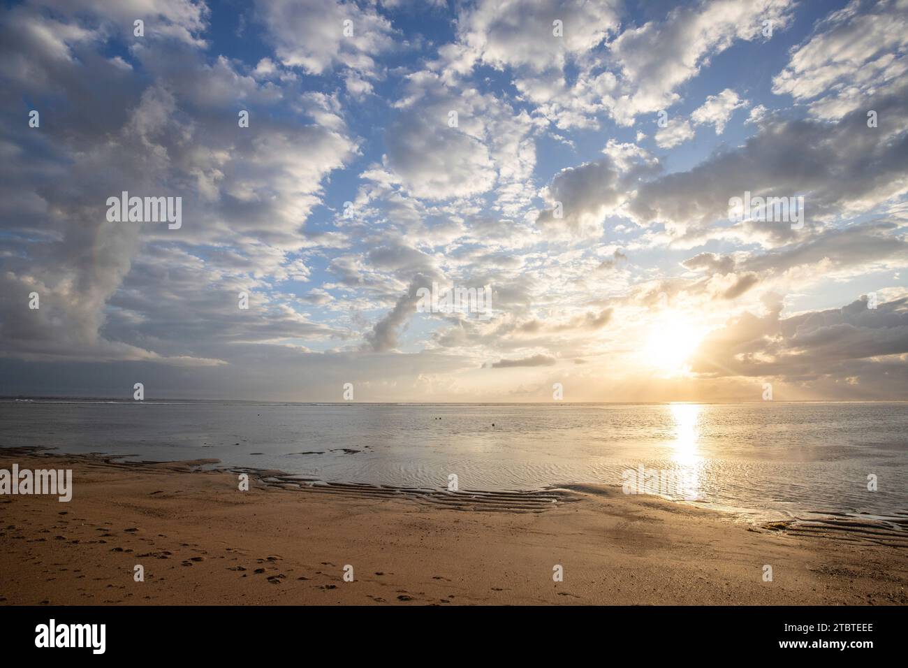 Sunrise on sandy beach, landscape shot with view of the sea and the ...