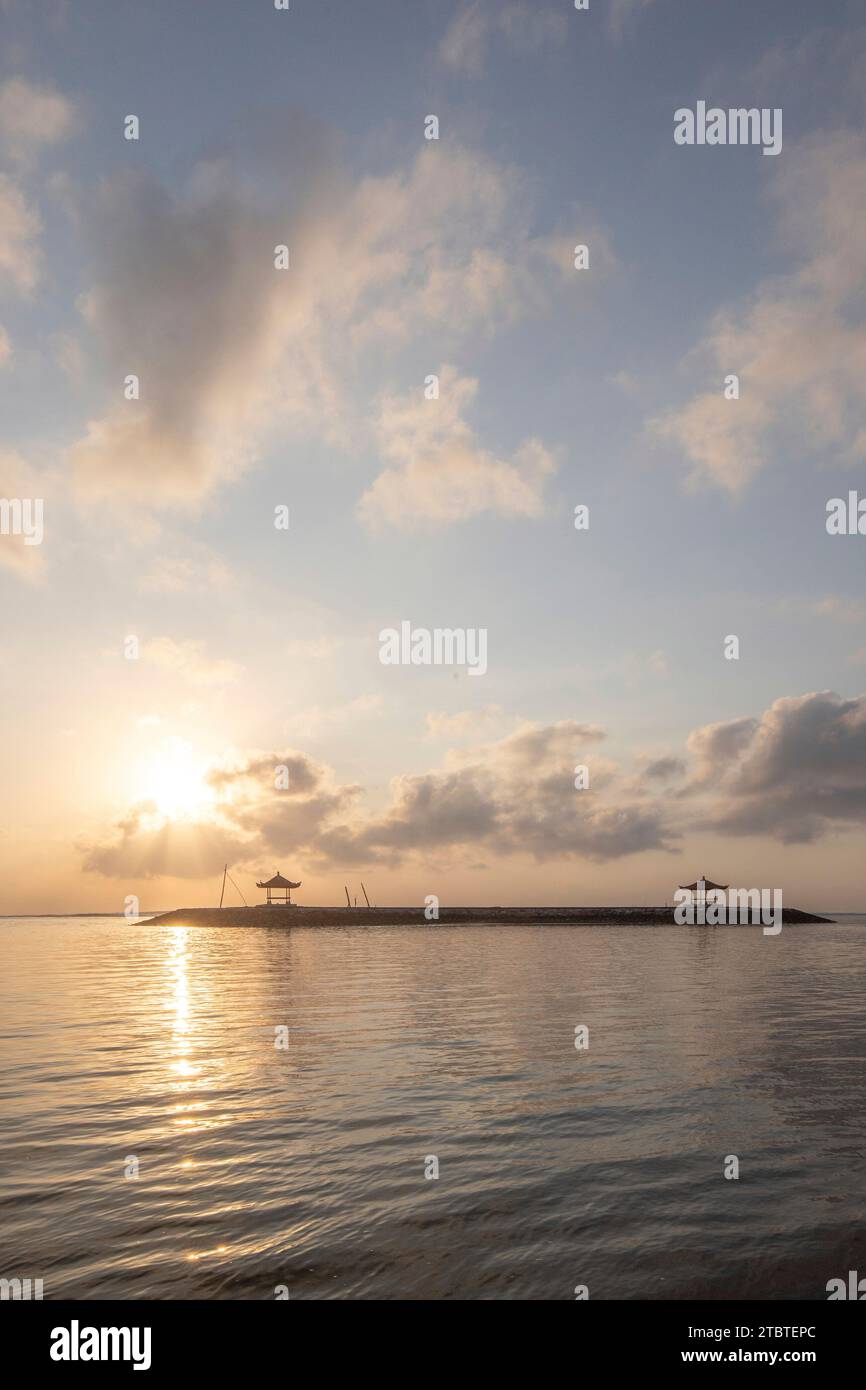 Sunrise over the sea, view from the sandy beach to the horizon, in the ...
