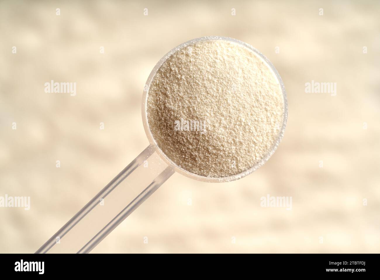 Collagen powder in a plastic measuring cup, top view. Nutritional ...