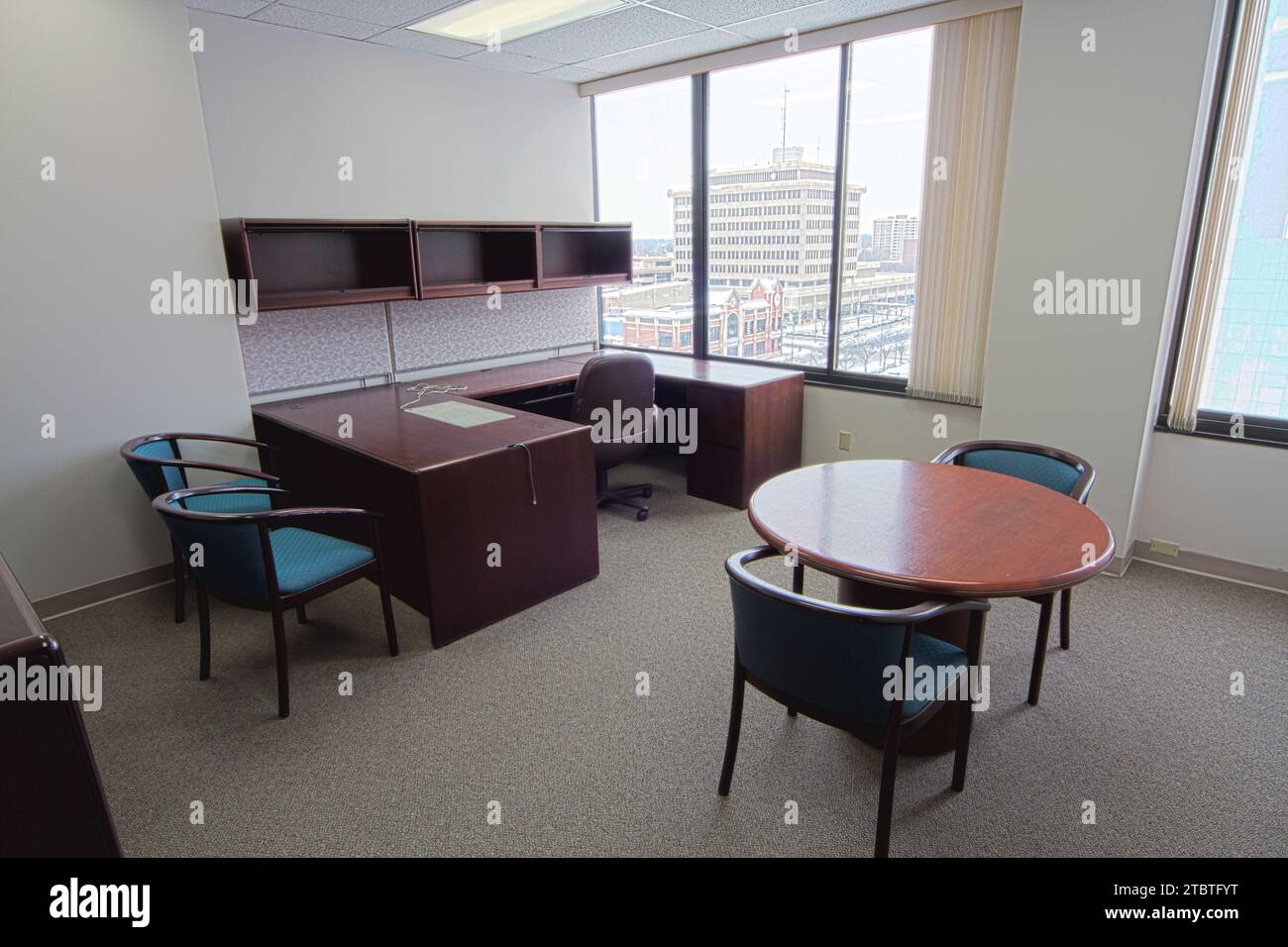 Spacious City Office with Executive Desk and Meeting Area, Daytime View ...