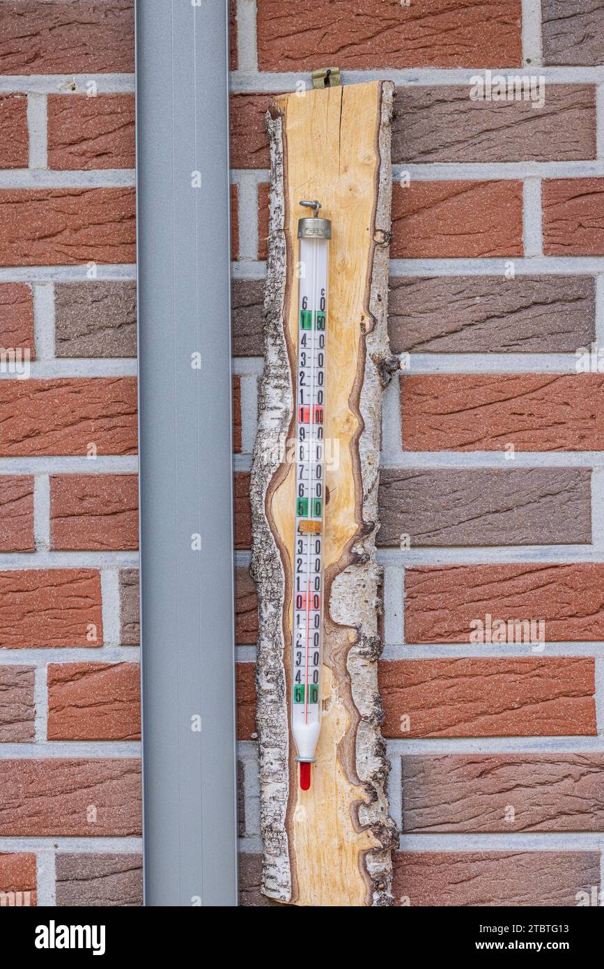 Old mercury thermometer in a wooden holder on a house wall Stock Photo ...